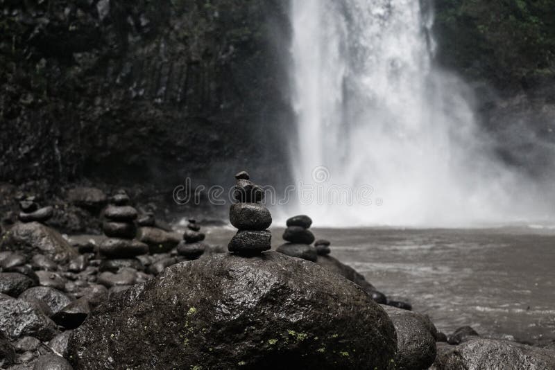 Zen Stone at Waterfall with Blur Background Stock Photo - Image of ...