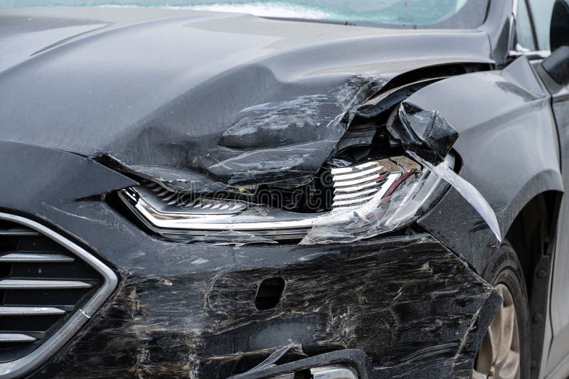 Severe Front-end Damage on Black Car with Shattered Headlight and ...