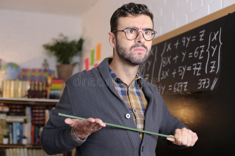 Severe School Teacher Holding Stick Stock Photo - Image of chalk, male ...