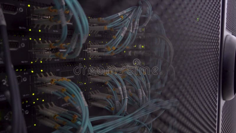 Severs Computer in a Rack at the Large Data Center. Optical Fiber Cable ...