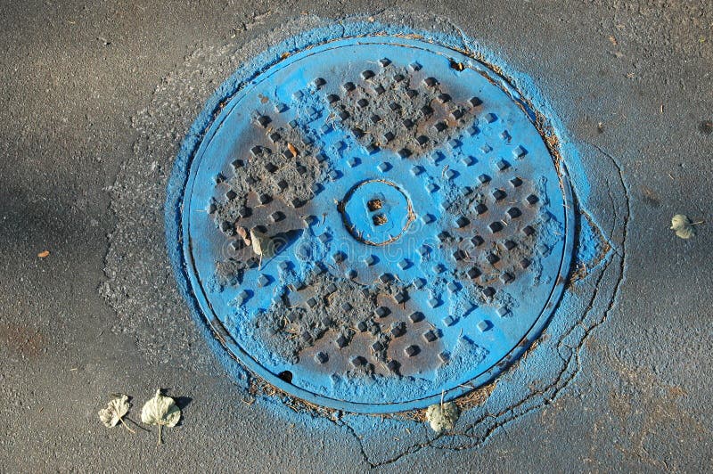 Sewer Cover with Blue Paint. Stock Photo - Image of road, marks: 8822026