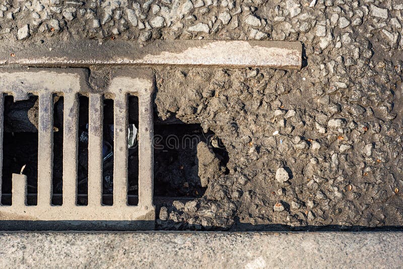 Sewer grate gutter on top stock photo. Image of cover - 146159234