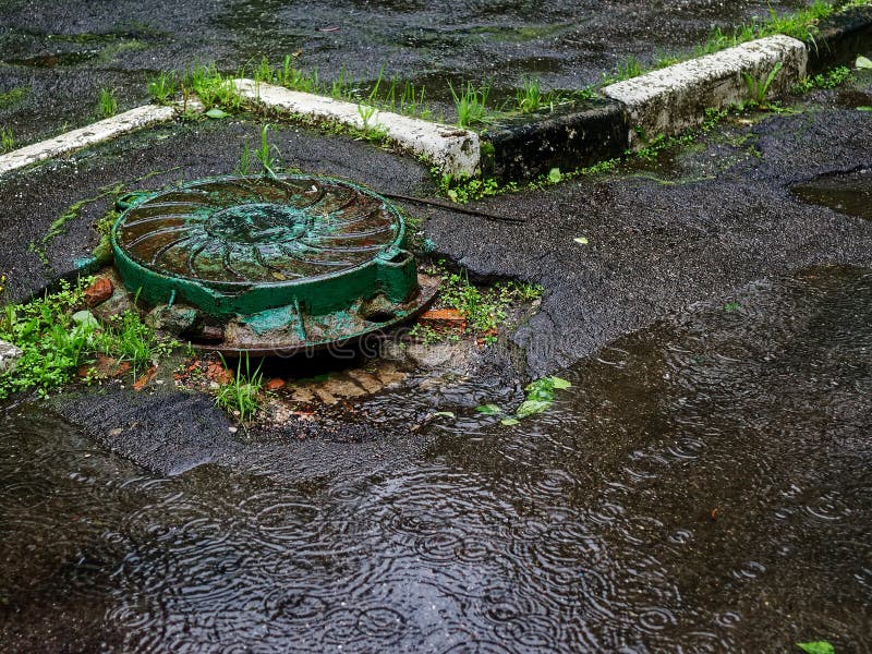 Sewer Hatch in the Flow of Water Stock Photo - Image of fall, city ...