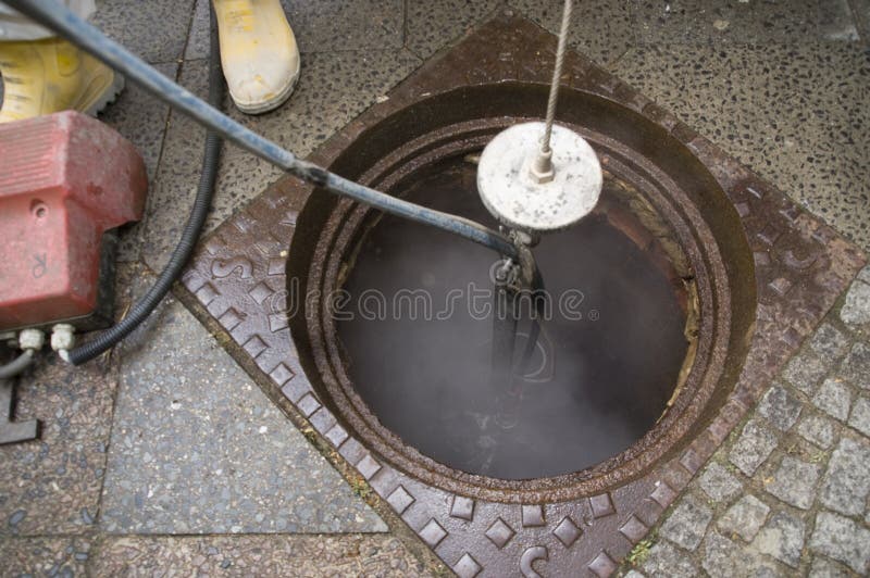 Sewer maintenance stock image. Image of pavement, close - 20236475
