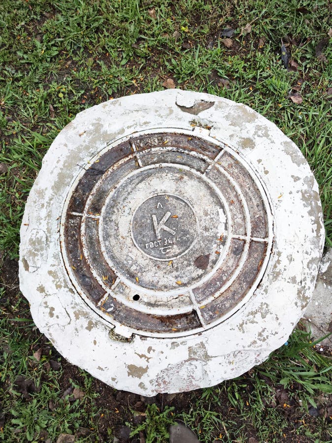 Sewer Manhole on Green Grass. Editorial Photography - Image of iron ...