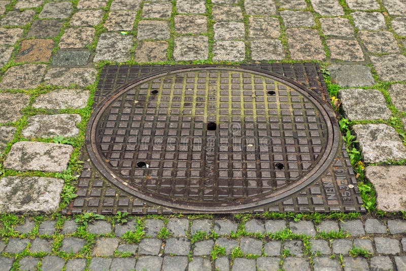 Brick manhole in the grass stock image. Image of background - 132020463
