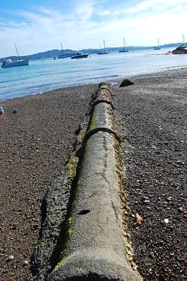 Sewer pipe at beach stock image. Image of boats, clouds - 8226487