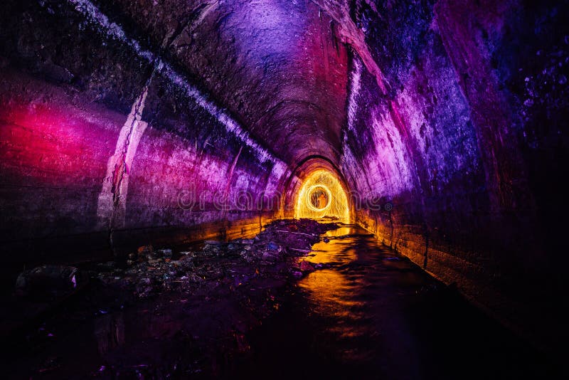 Sewer Tunnel Illuminated by Color Lanterns Stock Photo - Image of color ...