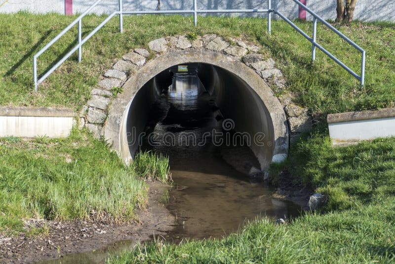 Sewer, Tunnel with Reflection and Light at the End Stock Image - Image ...