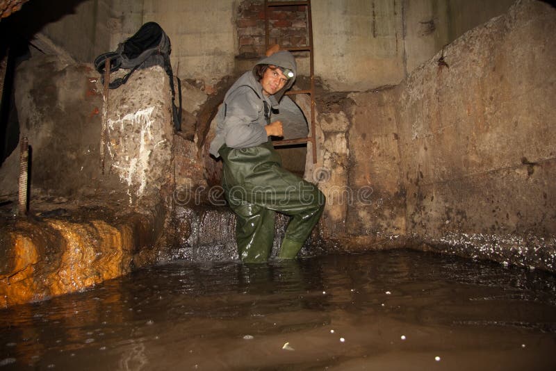 Sewer Worker in Underground Flooded Sewage Collector Stock Photo ...