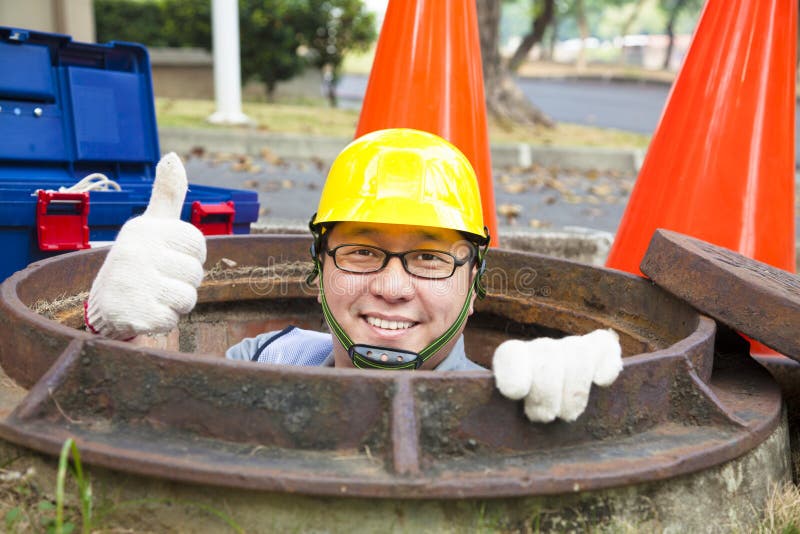 Sewerage Worker In The Manhole Stock Image - Image: 36054641