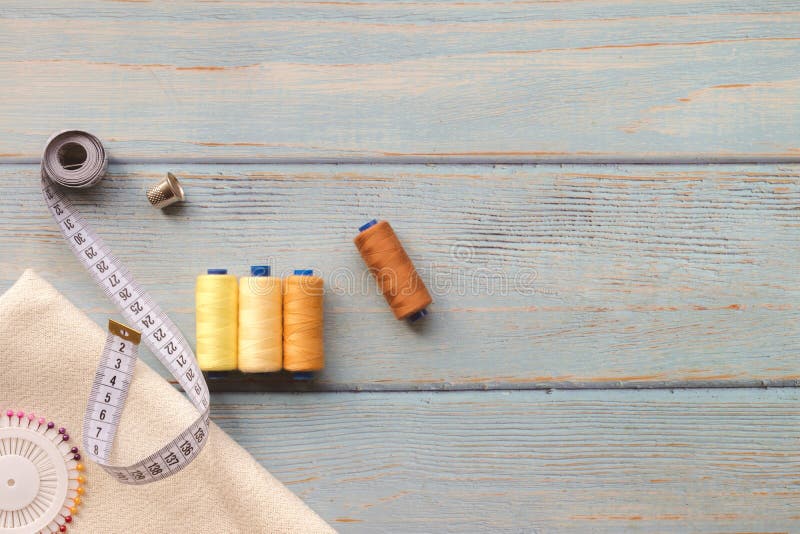 Sewing Accessories and Fabric on a Blue Background. Fabric, Sewing ...