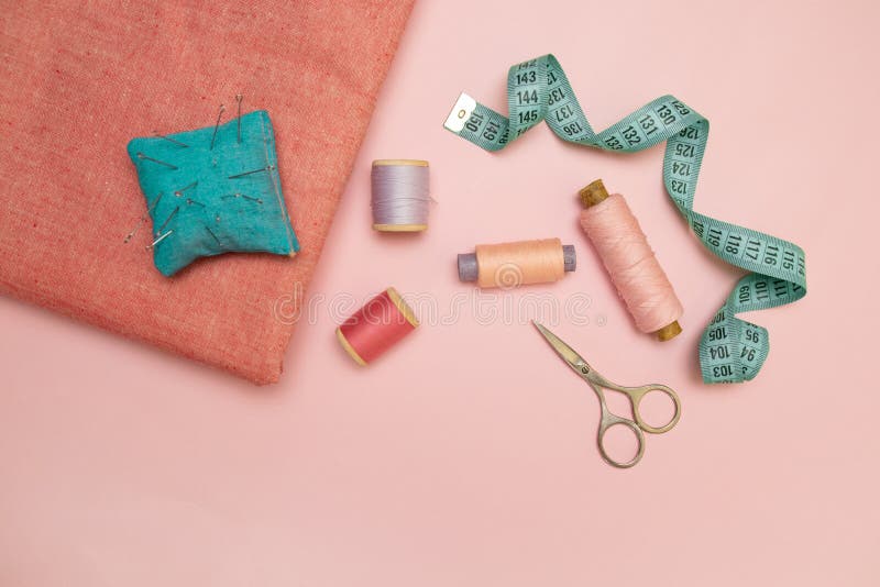 Sewing Accessories and Fabric on Pink Background Stock Photo - Image of ...