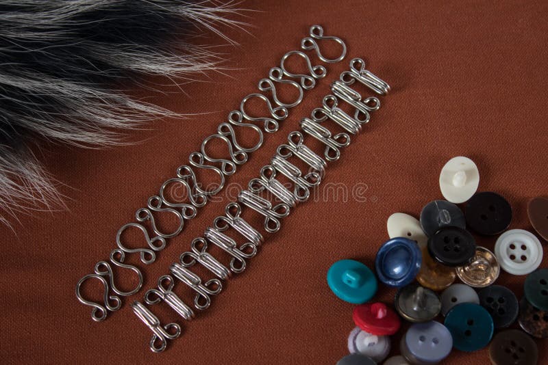 The Sewing Accessories are Laid Out on a Brown Fabric Stock Image ...