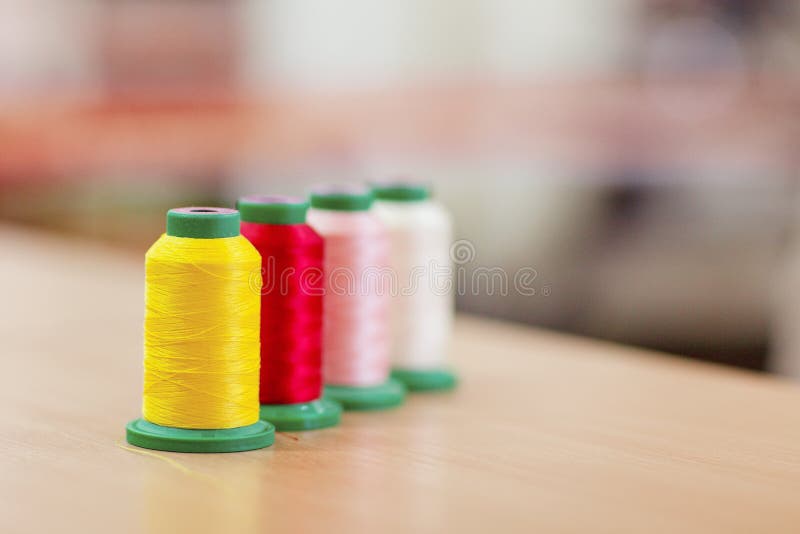 Sewing Accessories on a Wooden Table. Sewing Thread Close-up Yellow ...