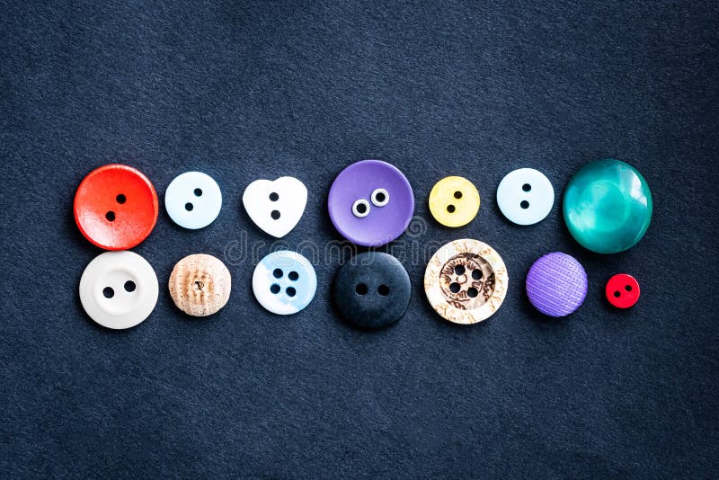 Sewing Buttons Lying on Dark Cloth Stock Photo - Image of copyspace ...