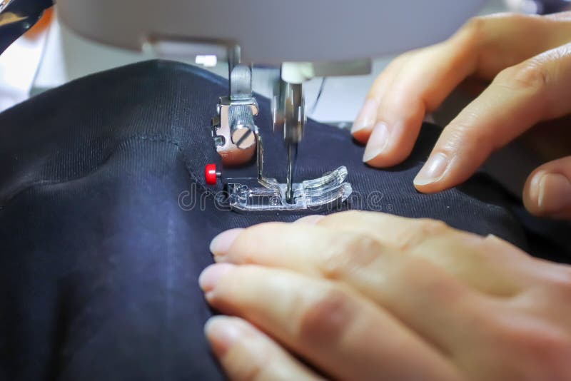 Sewing Concept. Female Hands Working at a Modern Sewing Machine with ...
