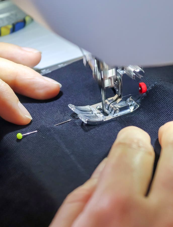 Sewing Concept. Female Hands Working at a Modern Sewing Machine with ...
