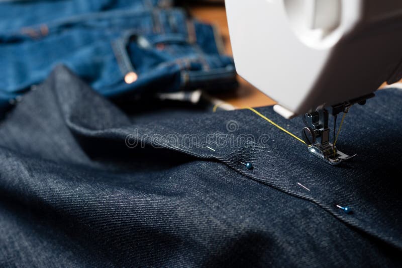 Sewing denim jeans stock photo. Image of clothing, jeans - 345622060