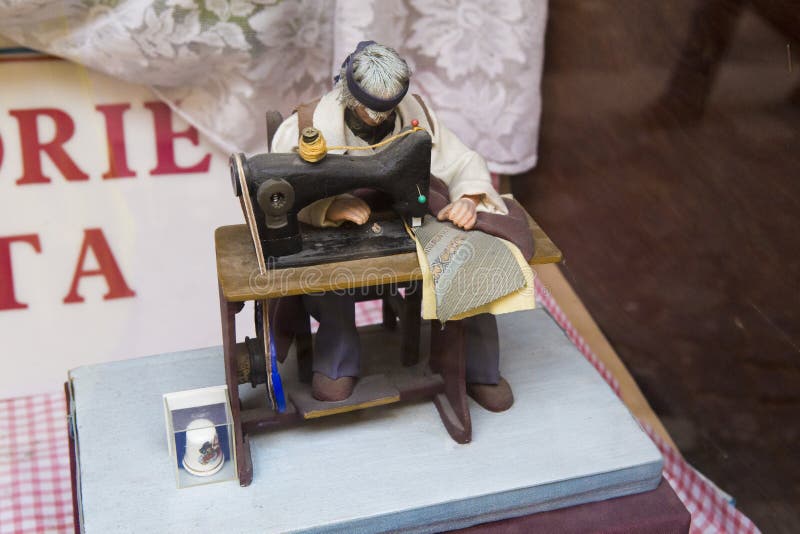 Tailor Sewing on a Sewing Machine Figurine Stock Photo - Image of ...