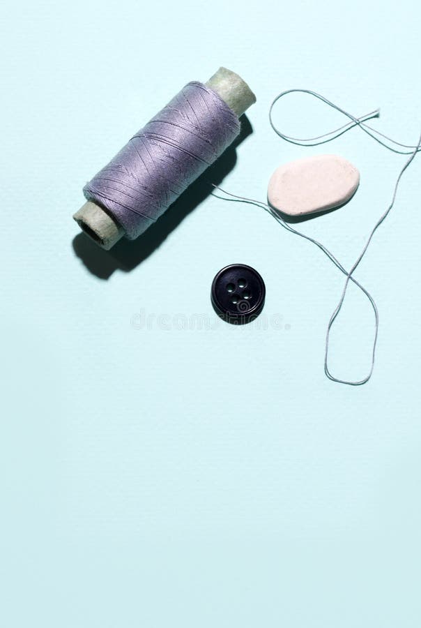 Sewing Home Concept. Threads on a Blue Background Stock Photo - Image ...