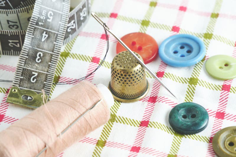 Sewing Kit Consisting Needle, Thimble, Threads and Measuring Meter on a ...