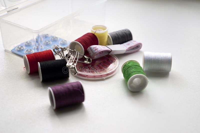 Sewing Kit Thread Needles Pins and Measuring Tape on the Table Stock ...