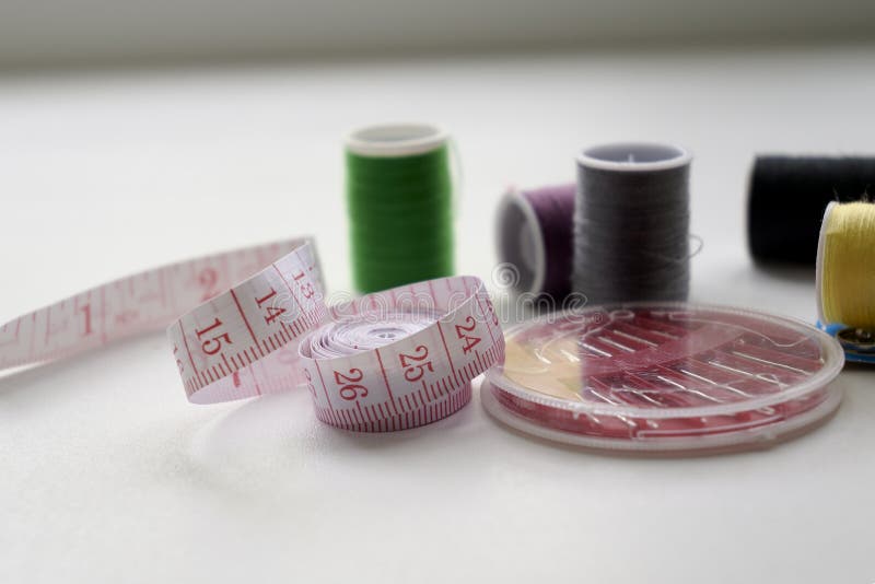 Sewing Kit Thread Needles Pins and Measuring Tape on the Table Stock ...