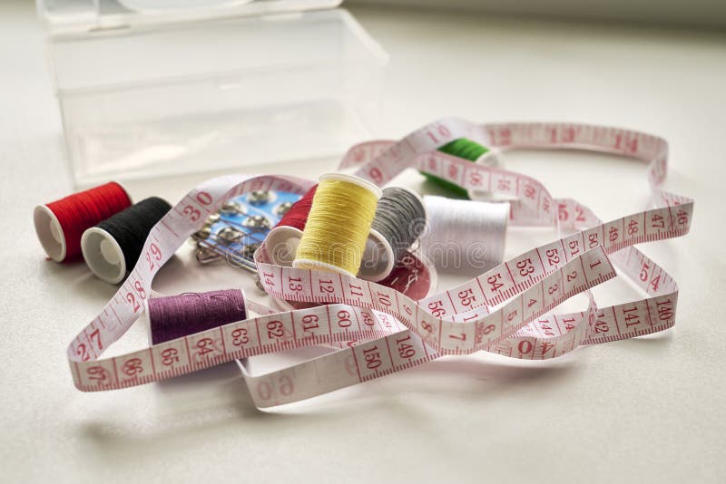 Sewing Kit Thread Needles Pins and Measuring Tape on the Table Stock ...