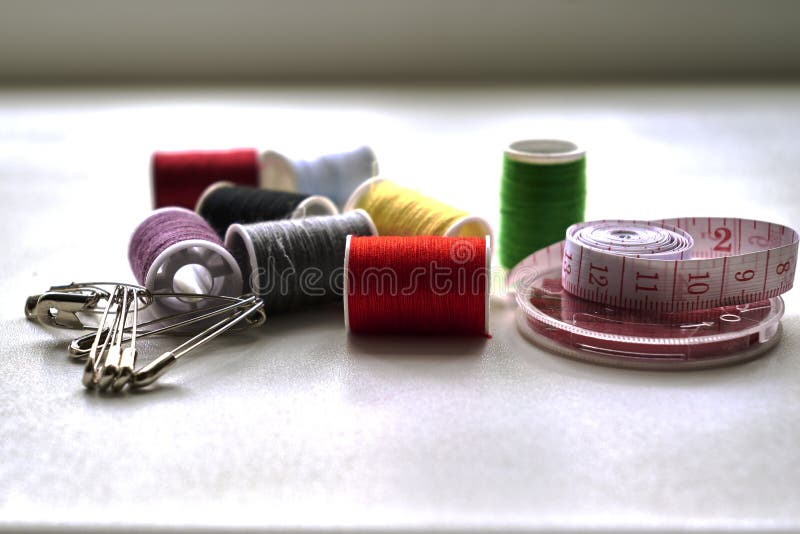Sewing Kit Thread Needles Pins and Measuring Tape on the Table Stock ...