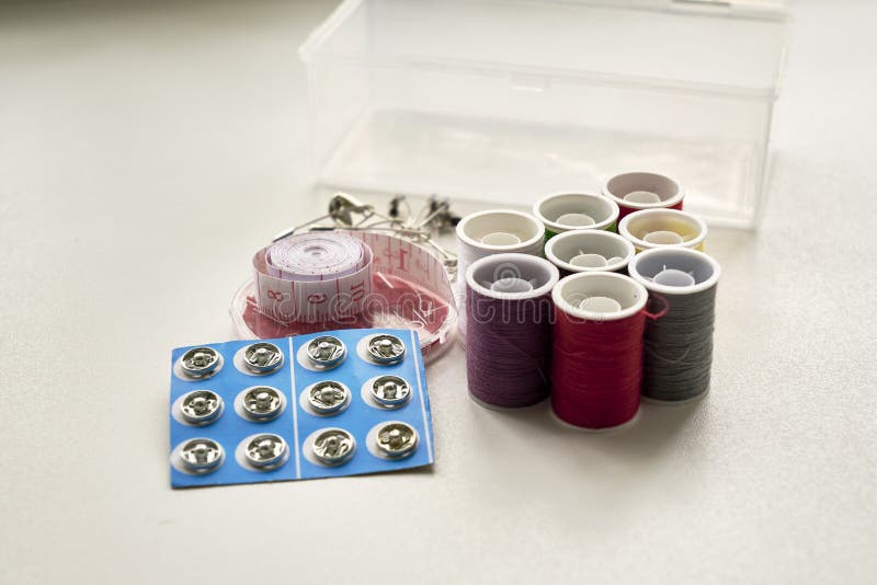 Sewing Kit Thread Needles Pins and Measuring Tape on the Table Stock ...