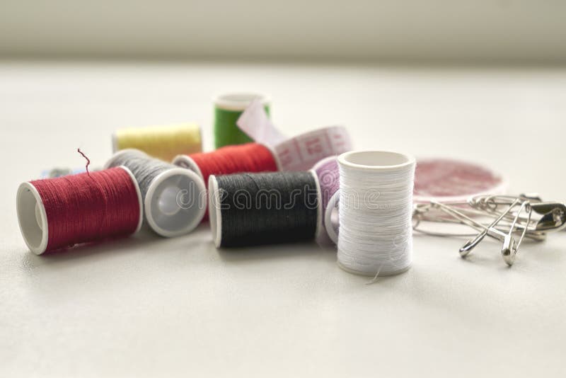 Sewing Kit Thread Needles Pins and Measuring Tape on the Table Stock ...