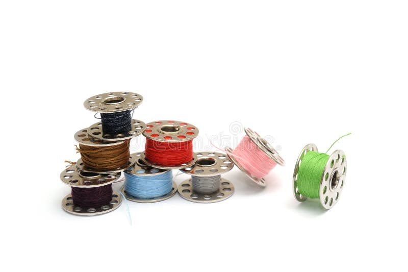 Sewing machine bobbins stock image. Image of colorful - 33300587