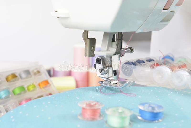 Sewing Machine and Colorful Thread Rolls, Scissors, Fabric and a Stock ...