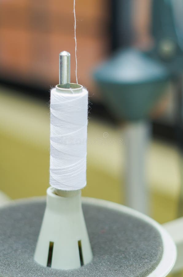 A Spool of Thread and a Needle with a Thread Stock Photo - Image of ...