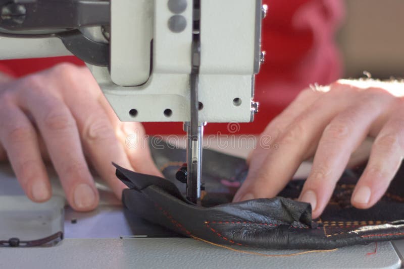 Sewing Machine in a Leather Workshop in Action with Hands Working with ...