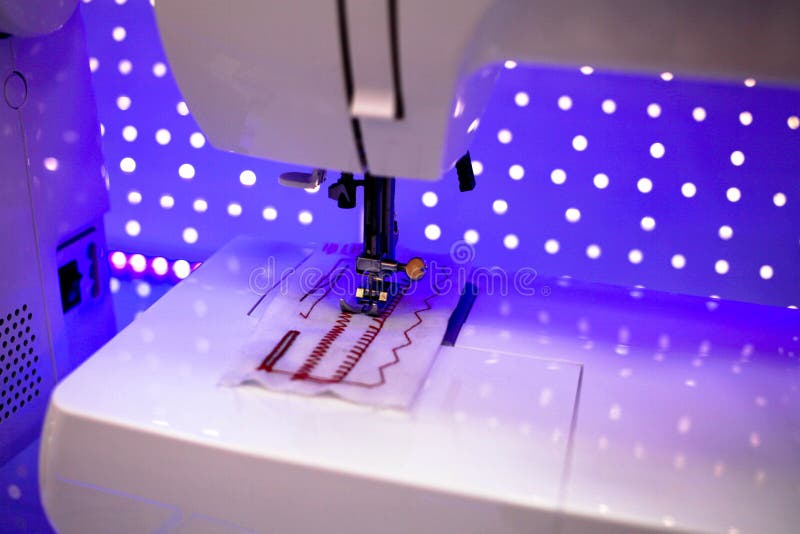 Sewing Machine with a Piece of Fabric Red Thread with Different Lines ...