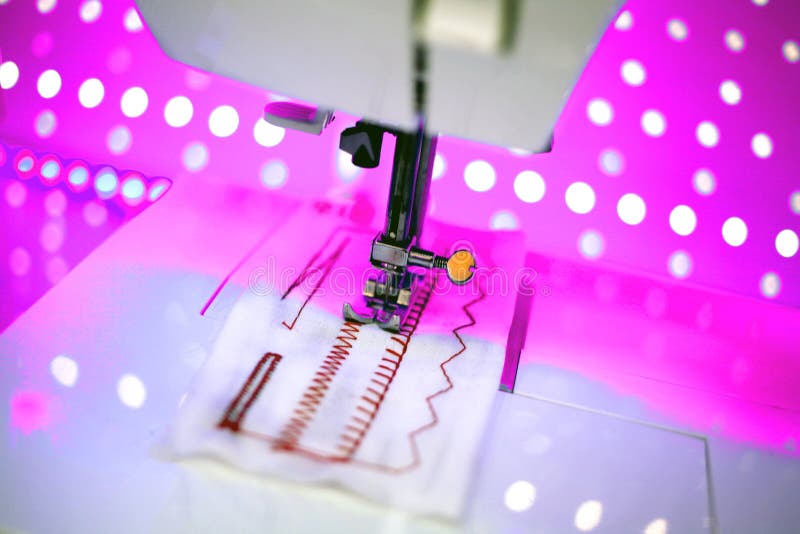 Sewing Machine with a Piece of Fabric Red Thread with Different Lines ...