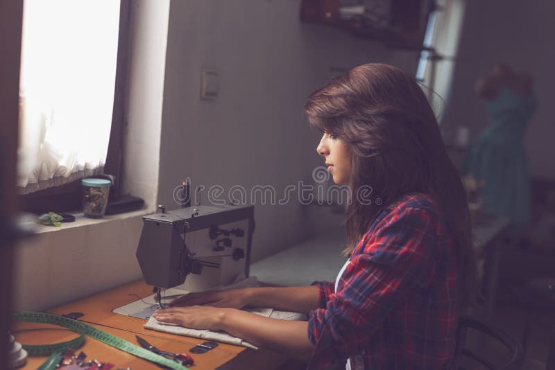 Sewing on a sewing machine stock image. Image of dress - 107747887