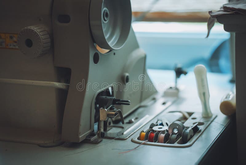 Sewing machine and threads stock image. Image of fabric - 298680453