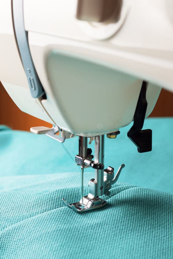 A Sewing Machine and Item of Clothing . Stock Image - Image of metal ...