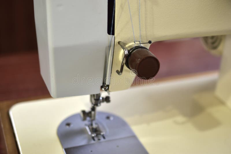 Sewing Machine and Work Surface with Needle and Thread Stock Image ...