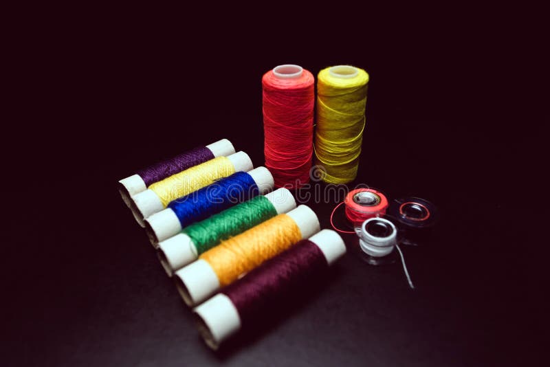 Sewing Multi-colored Threads on a Black Background Stock Photo - Image ...