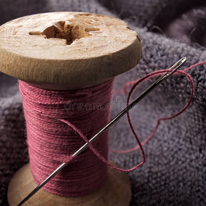 Sewing Needle and Cotton Thread on Wooden Spool Macro View. Stock Photo ...