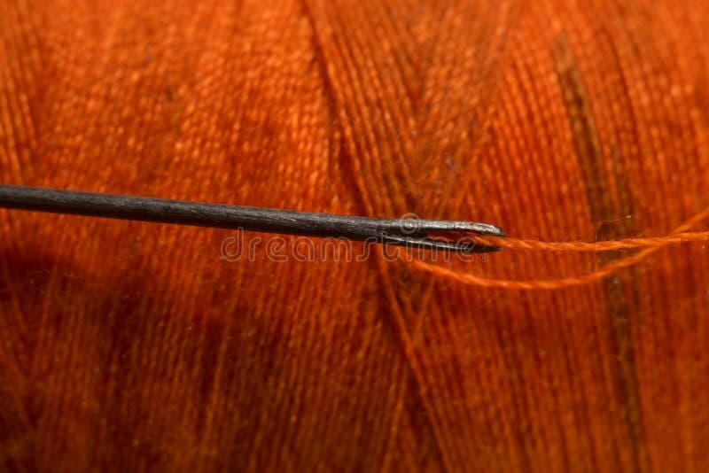 Sewing Needle on Orange Bobbin Thread Stock Image - Image of hand ...