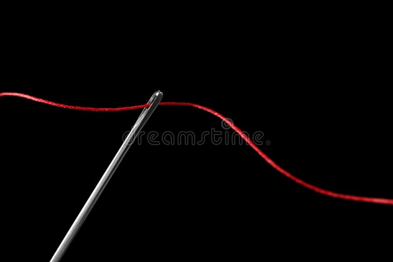 Sewing Needle with Red Thread on Black Background Stock Photo - Image ...
