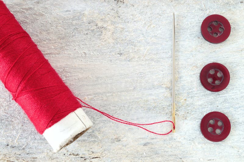 Sewing Needle, Red Thread and Three Buttons Top View Stock Photo ...