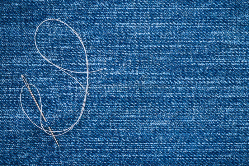 Sewing Needle and Thread on Denim with Copy Space Closeup Stock Image ...