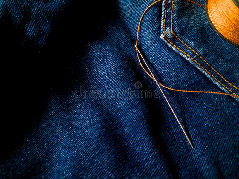 Sewing Needle and Thread on Dark Blue Denim Fabric Stock Photo - Image ...