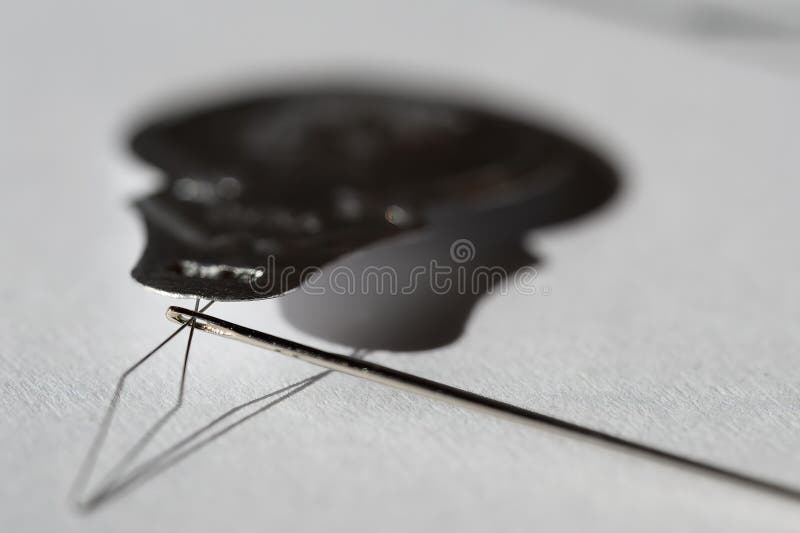 Sewing Needle Threader Tool in Use and a Single Black String. Stock ...